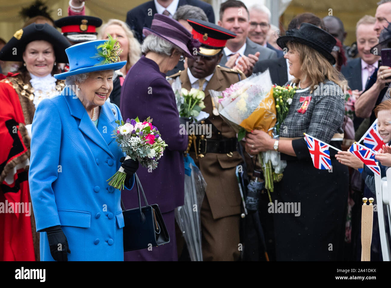 Queen Elizabeth II during a visit to Haig Housing Trust, Morden, London ...