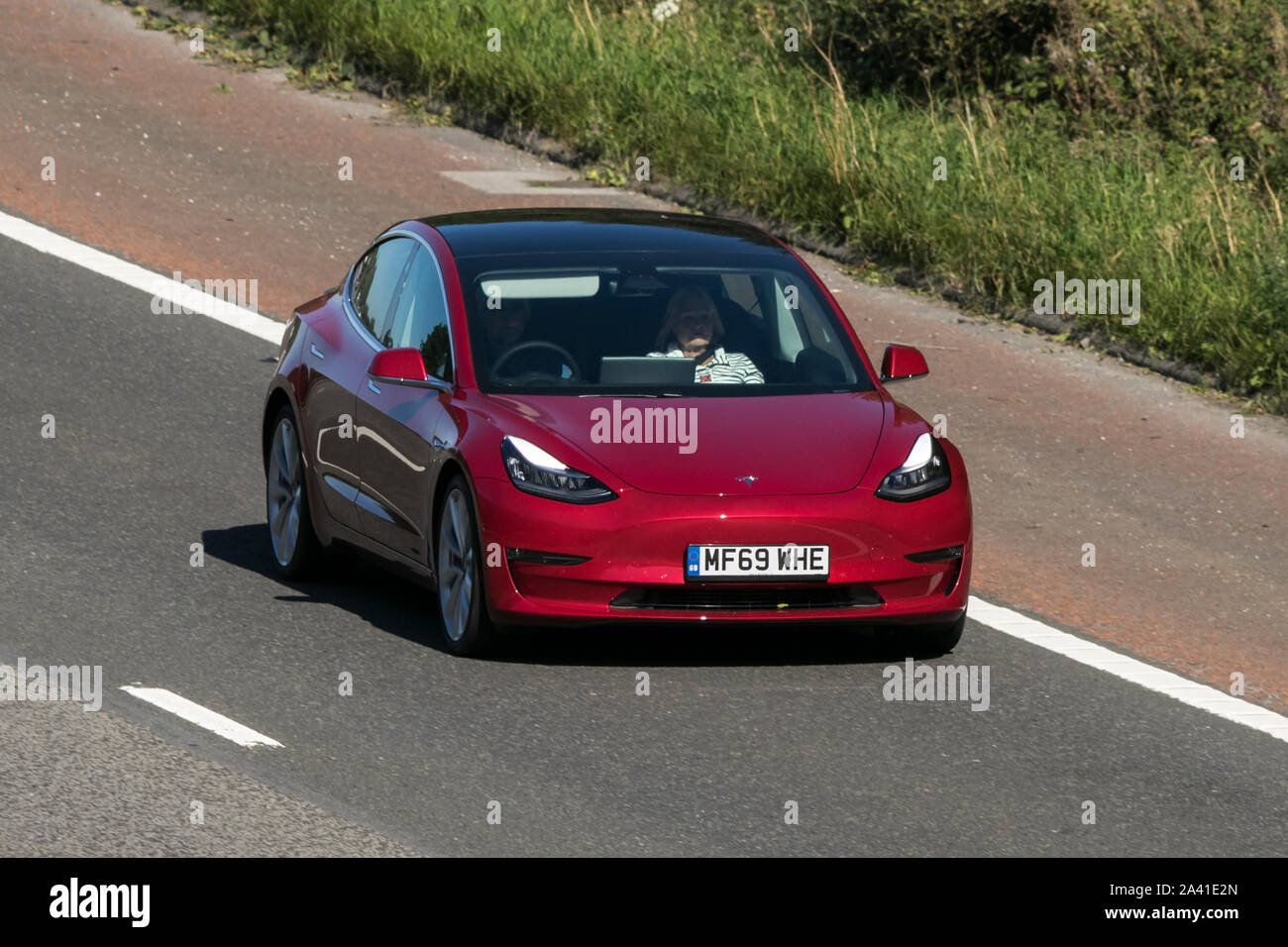 Electric powered Tesla Model 3 performance awd traveling on the M6 ...