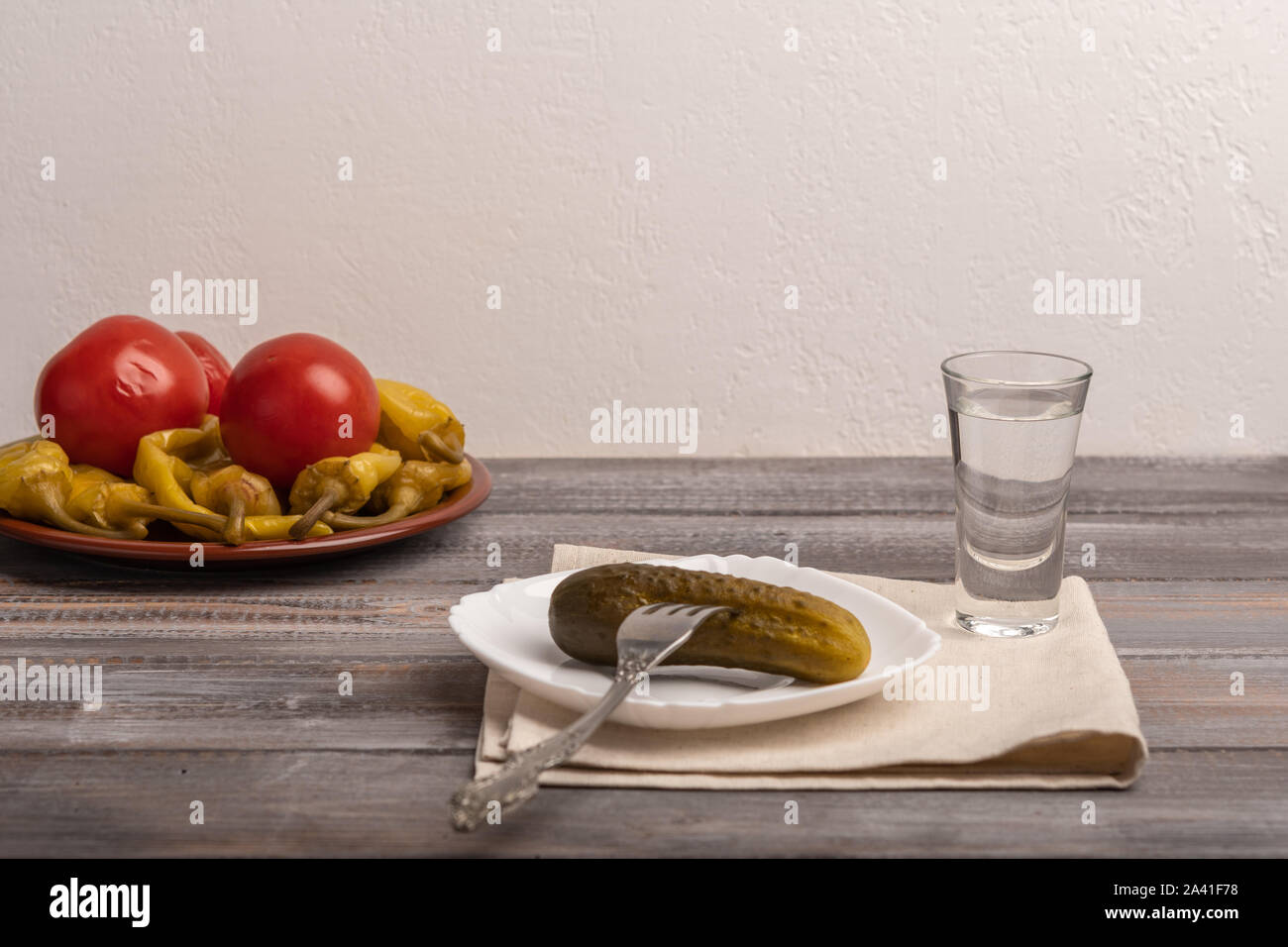 Traditional Russian snack - a glass of vodka and assorted pickles ...