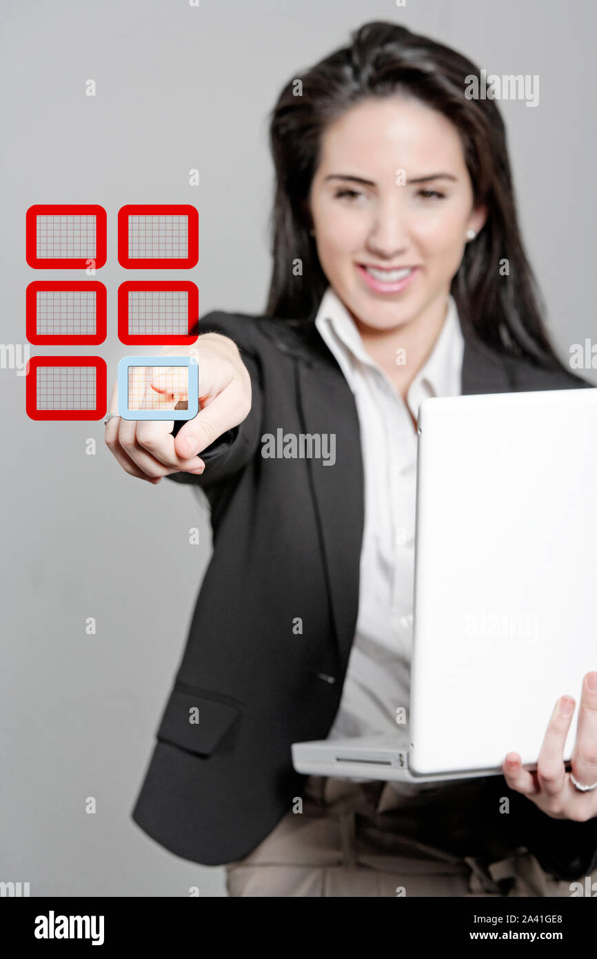 Professional business woman with laptop showing the concept of pressing ...