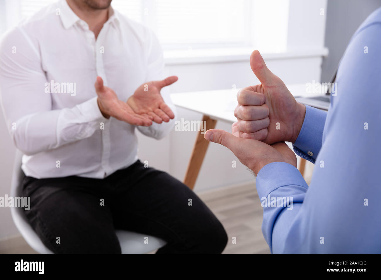 Disabilities showing sign language hi-res stock photography and images ...