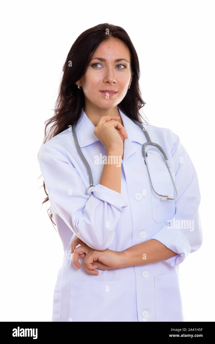 Studio shot of young beautiful woman doctor thinking Stock Photo - Alamy