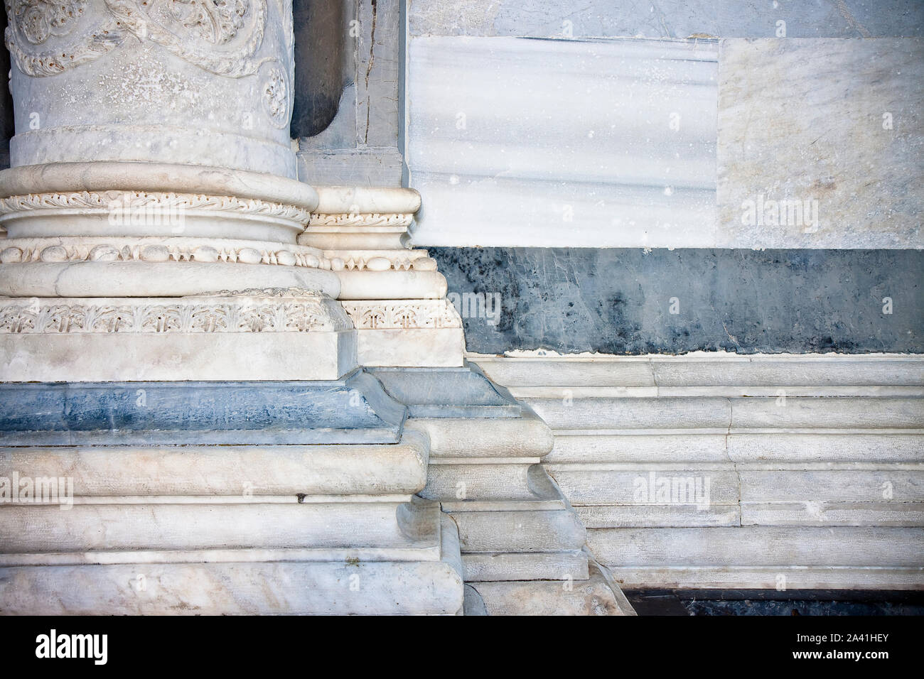 Base of the marble columns with white stone frame of a romanesque ...