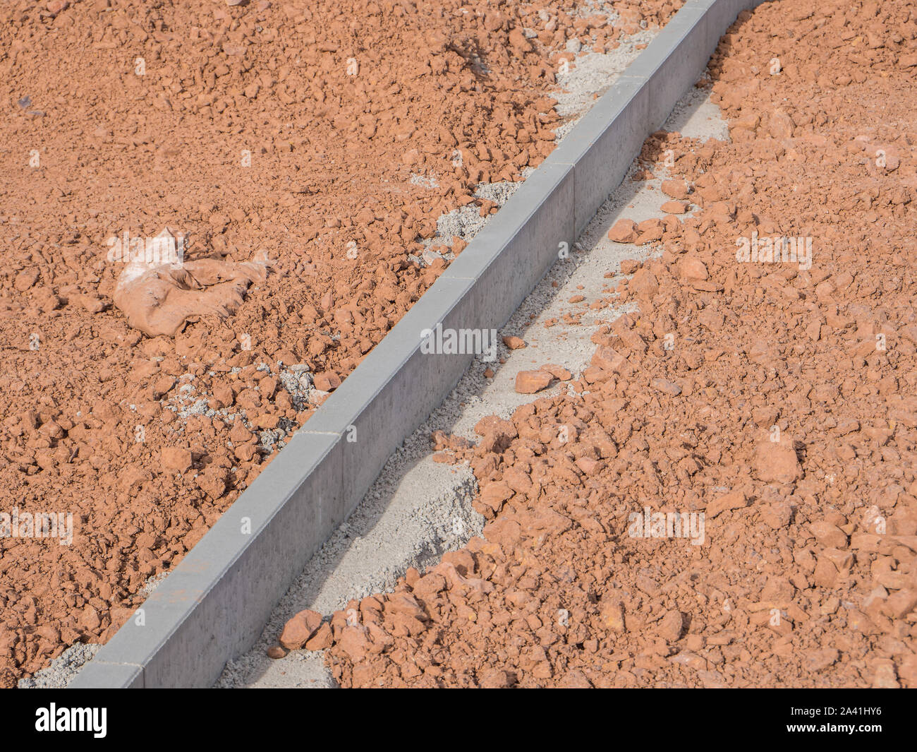 Curbstone building site Stock Photo - Alamy