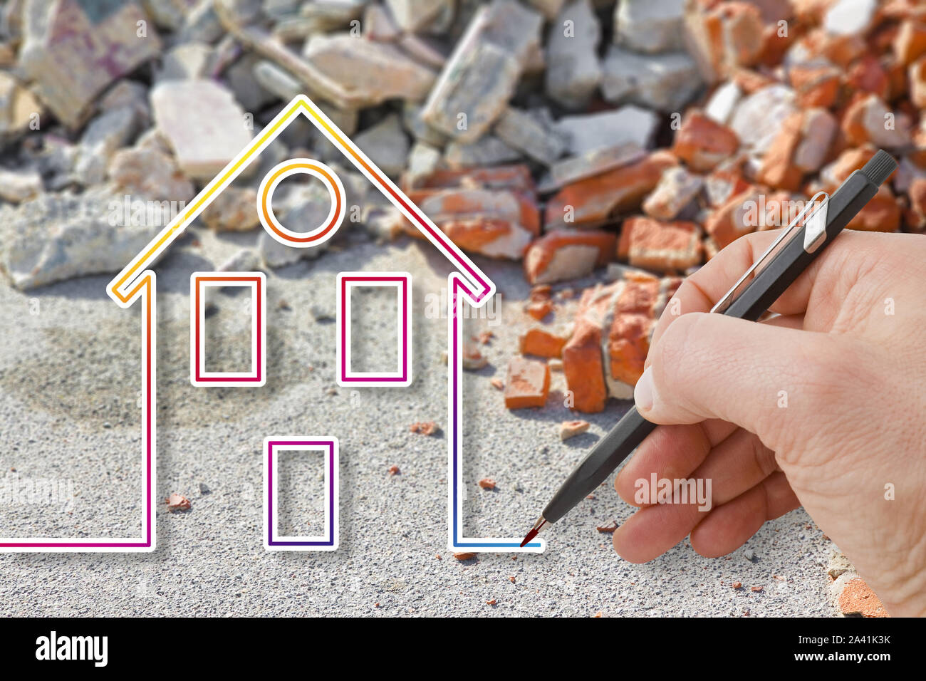 Hand drawing a colored house against a concrete and brick rubble debris ...