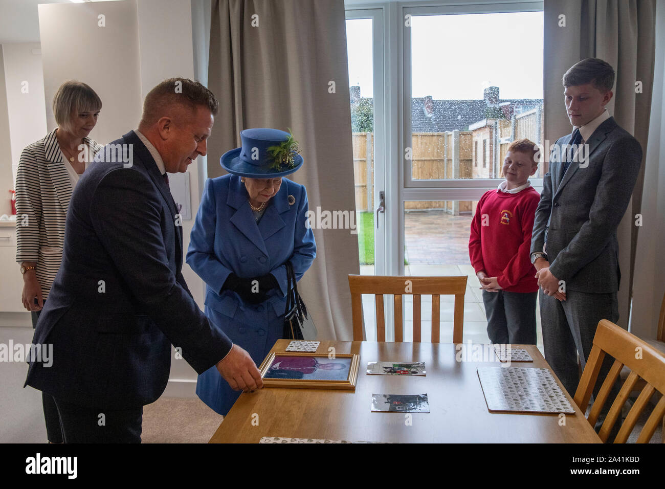 Queen Elizabeth II meets with veteran Mike Bowman and his family as she ...