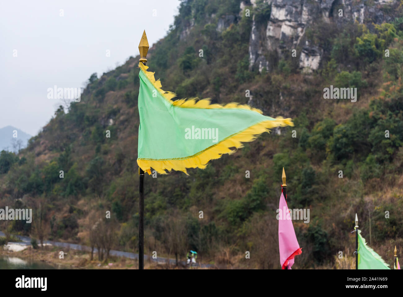 Flags at the stone wall of the ancient fortress in Qingyan Ancient Town ...