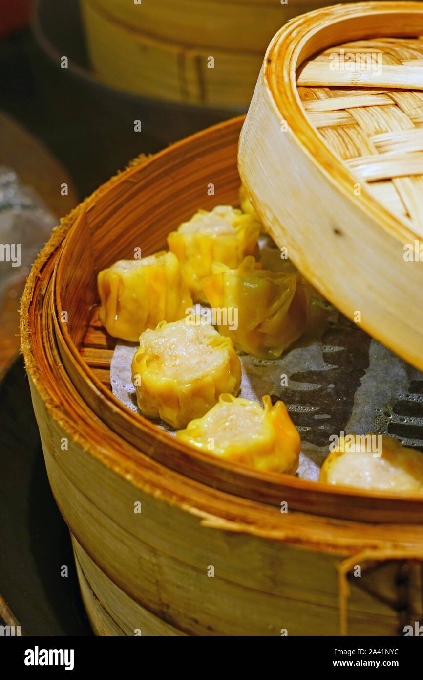 Dim sum shumai dumplings in a steam basket Stock Photo - Alamy