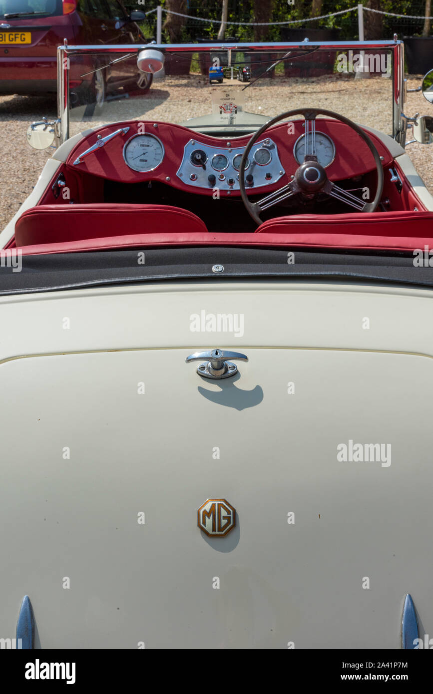 a classic MG sports car with red leather interior in cream. collectors ...