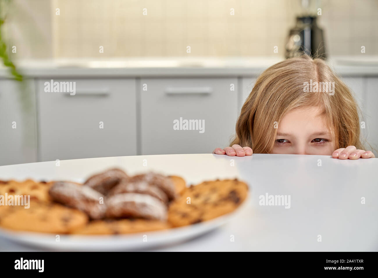 Little daughter tasting hi-res stock photography and images - Alamy