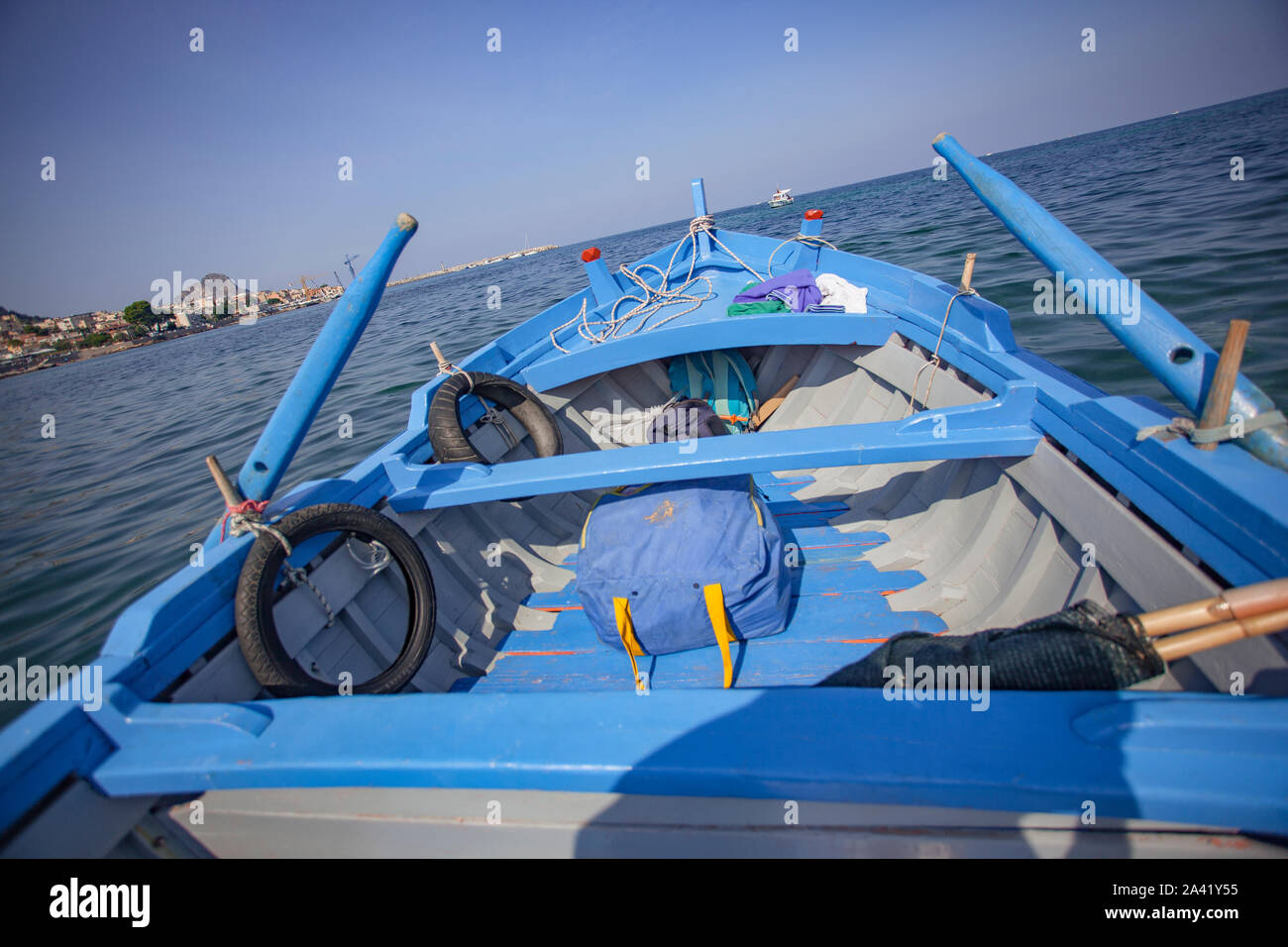 Blue Rowboat in sea 4 Stock Photo - Alamy