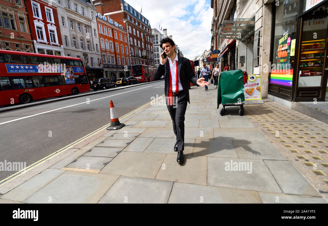 London, England, UK. Stylish young man on his mobile phone Stock Photo ...