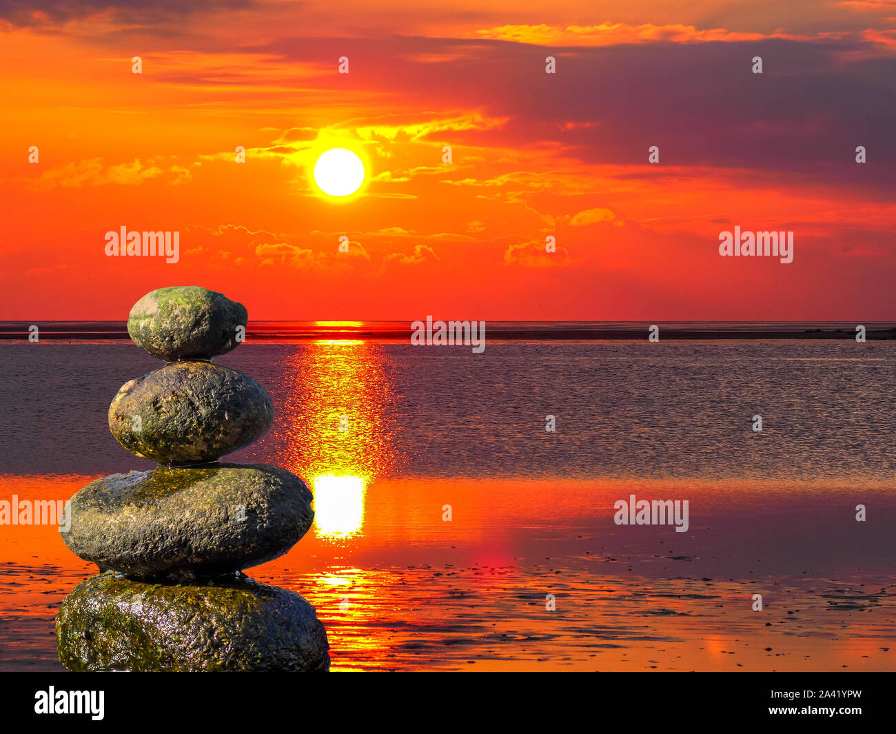 Stones of balance on the beach Stock Photo - Alamy