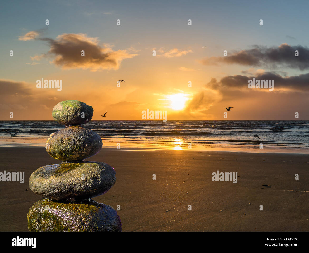 Stones of balance on the beach Stock Photo - Alamy