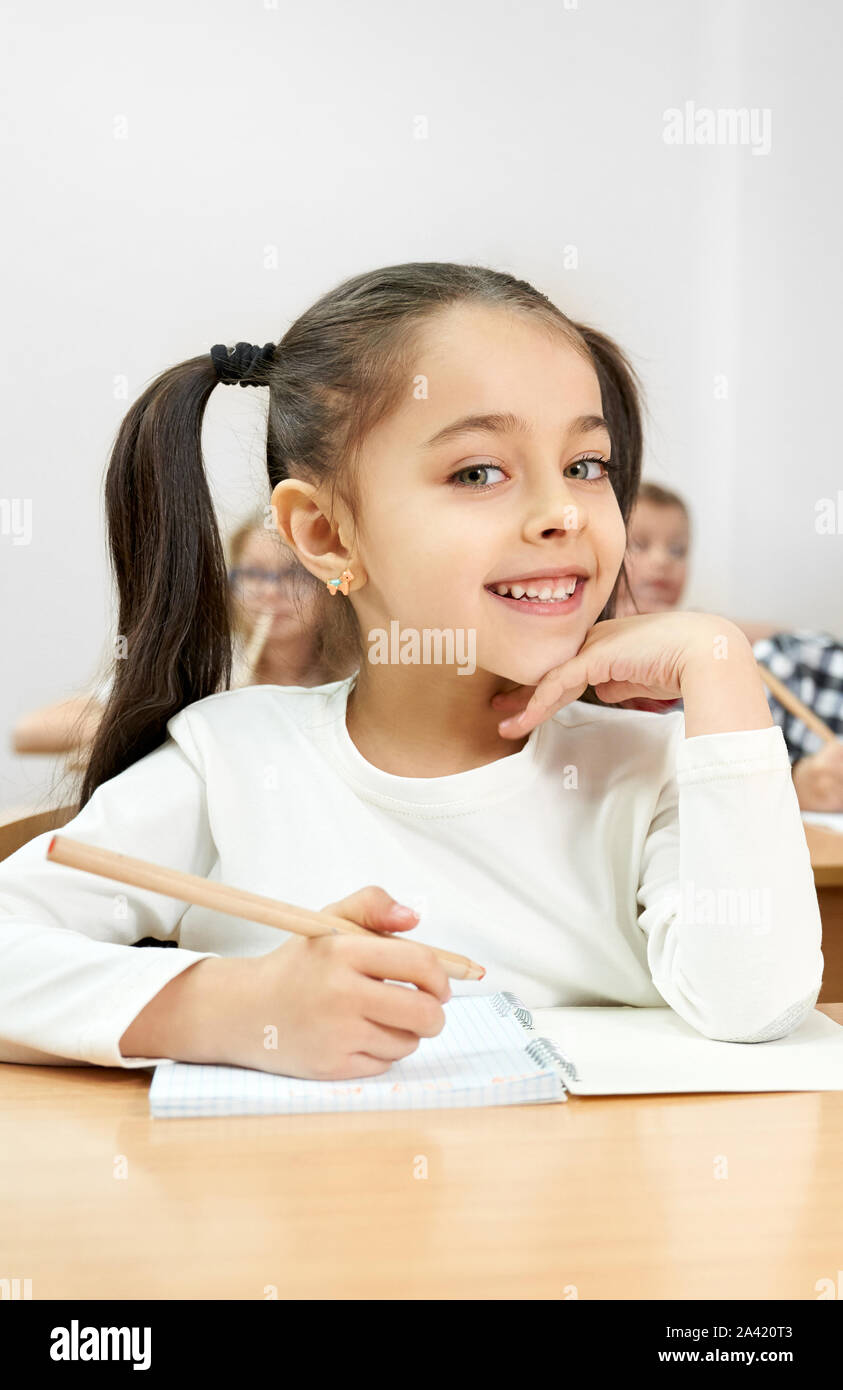 Pretty elementary school girl posing hi-res stock photography and ...