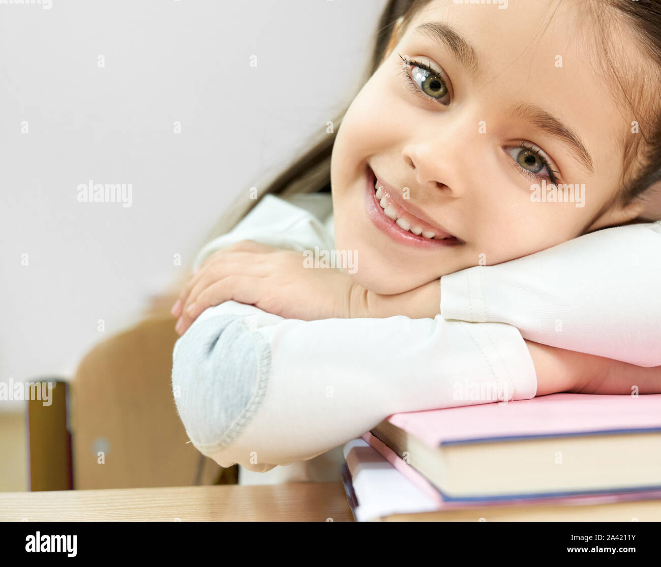 Pretty elementary school girl posing hi-res stock photography and ...