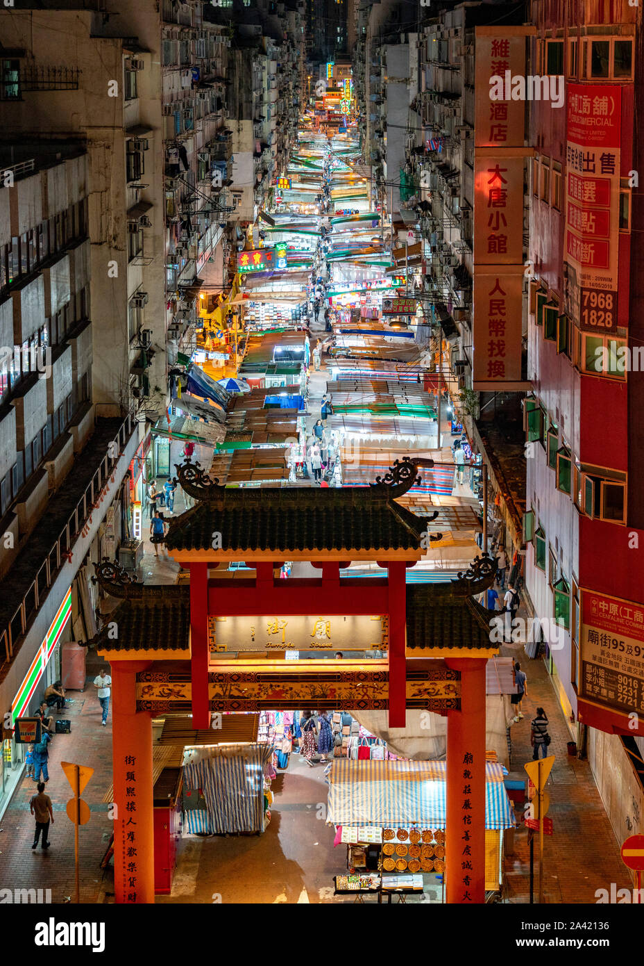 Night view of famous Temple Street Night market in Kowloon, Hong Kong ...