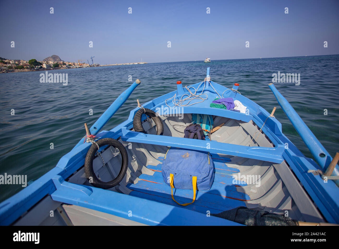 Blue Rowboat in sea 2 Stock Photo - Alamy