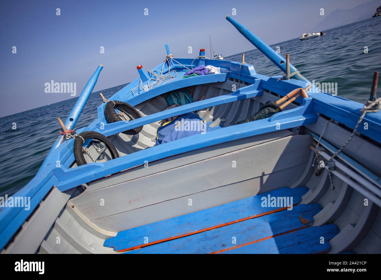 Blue Rowboat in sea Stock Photo - Alamy