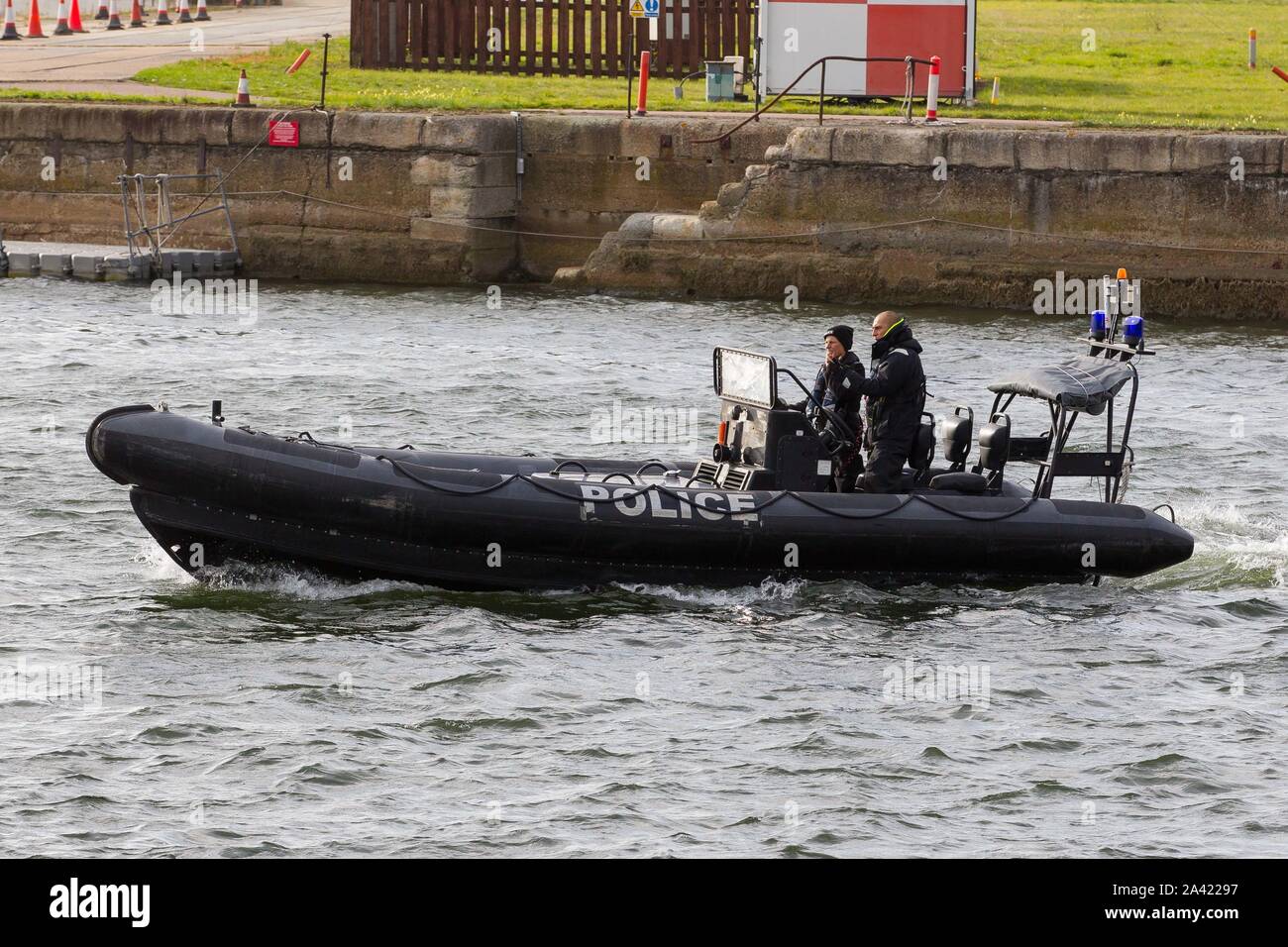 A marine police rigid inflatable boat RIB patrols the water around the ...