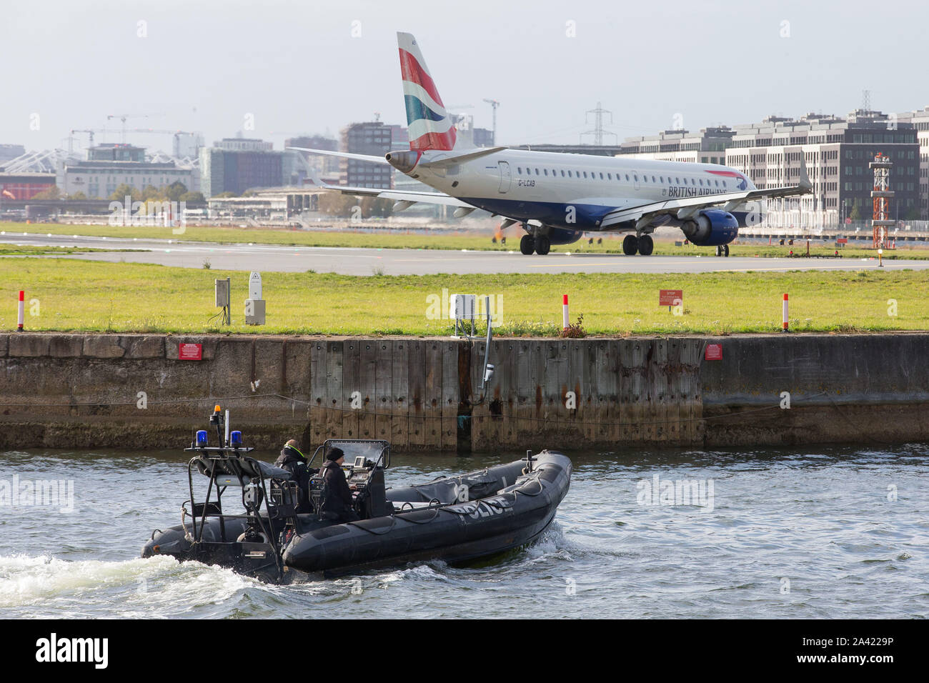 A marine police rigid inflatable boat RIB patrols the water around the ...