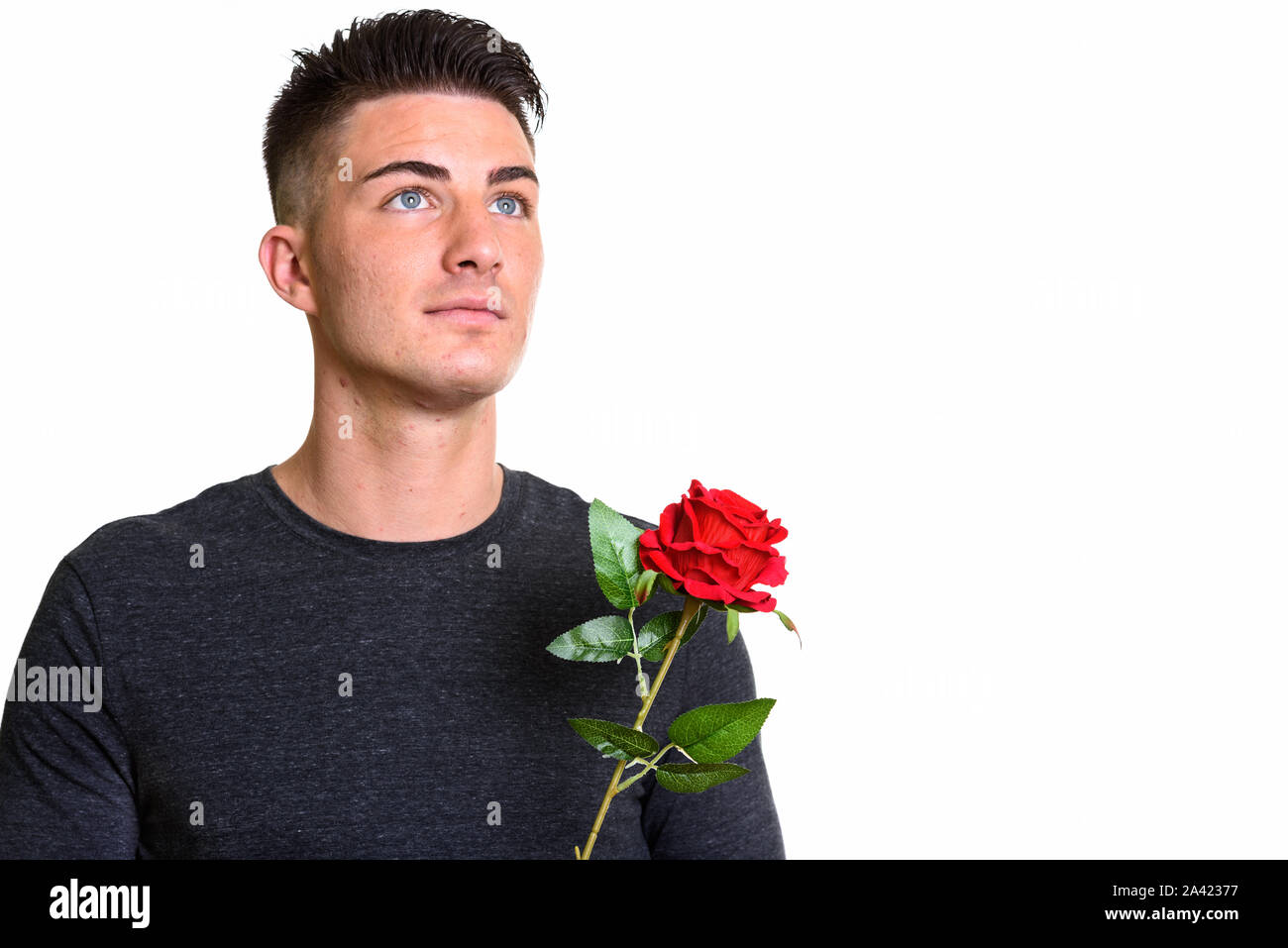 Man holding single red rose hi-res stock photography and images - Alamy