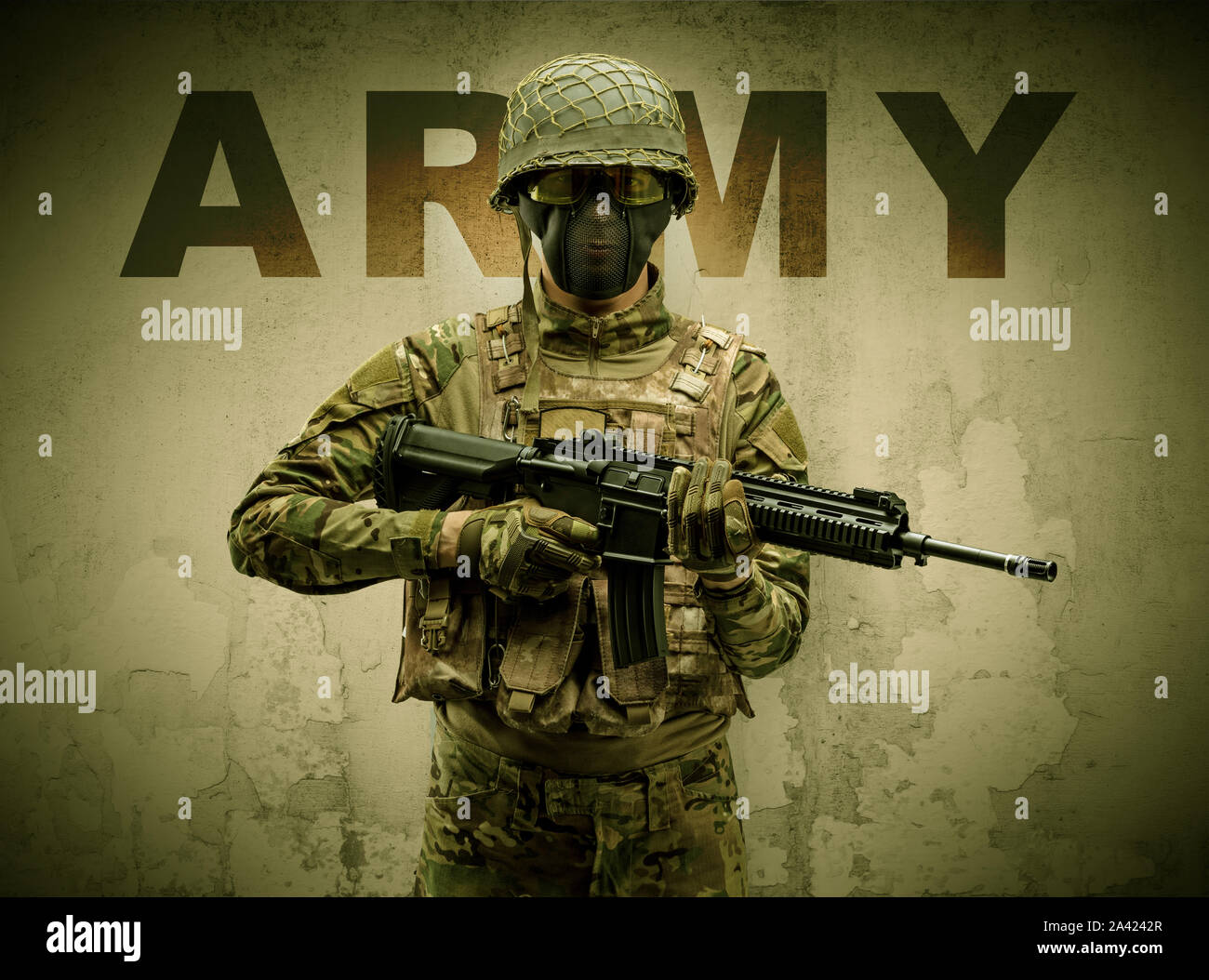 Uniformed armed soldier with damaged wall background Stock Photo - Alamy