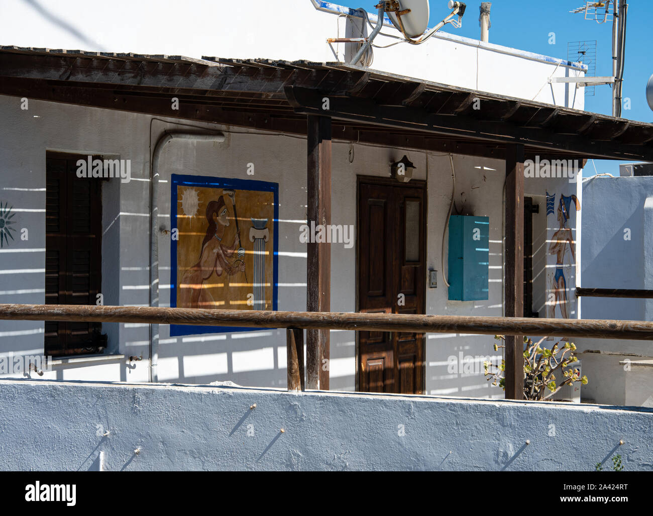 Fira, Greece - July 12 2019: A small house with murals replicating ...