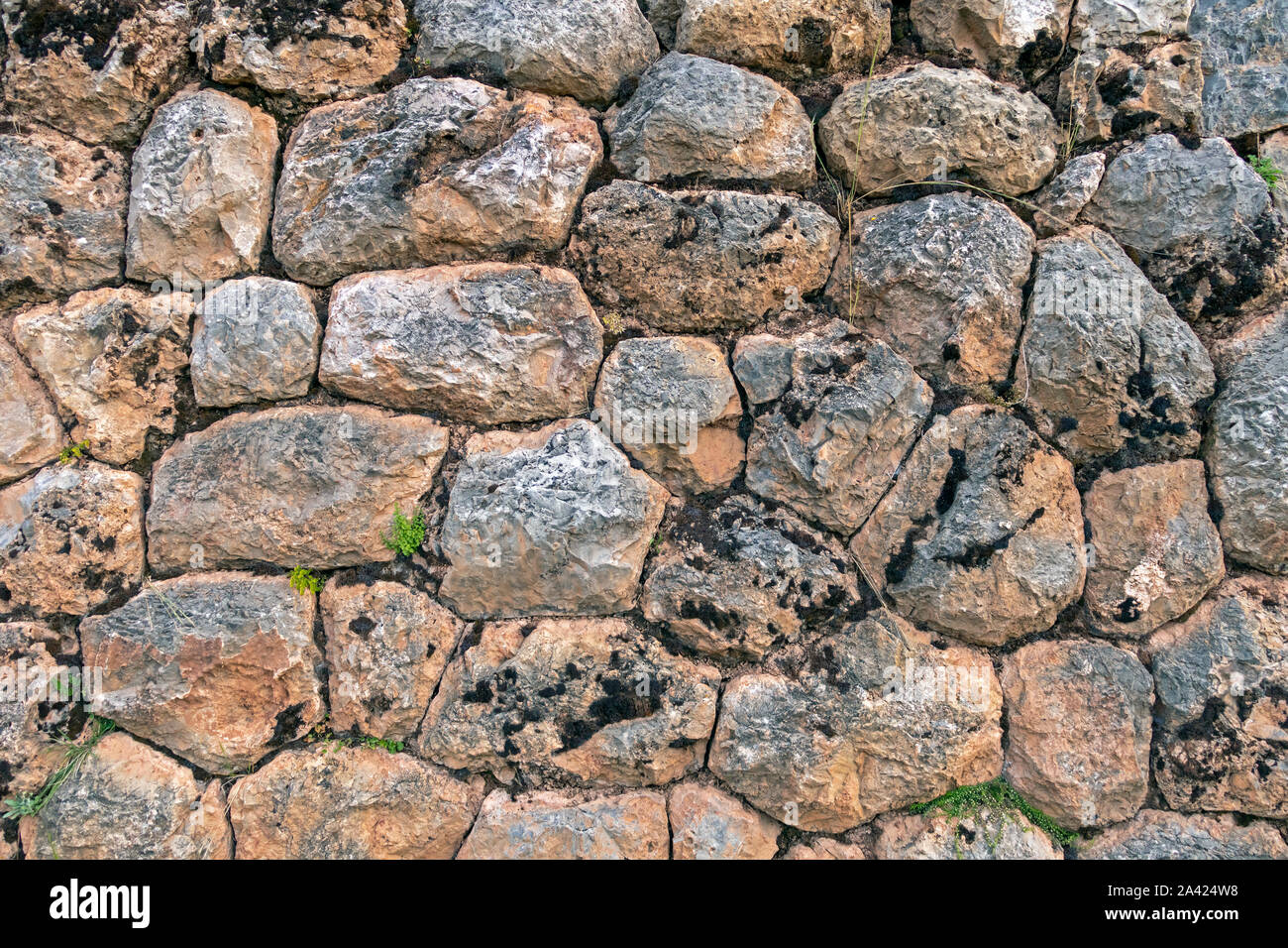 Natural Gray and brown stone brick background wall surface, fragment of ...