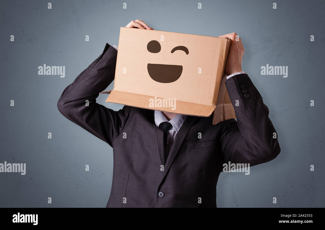 Funny man wearing cardboard box on his head with smiley face Stock ...