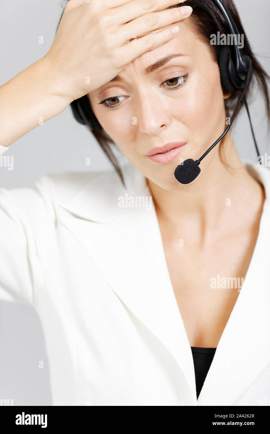 Call centre lady expressing concern and worry Stock Photo - Alamy