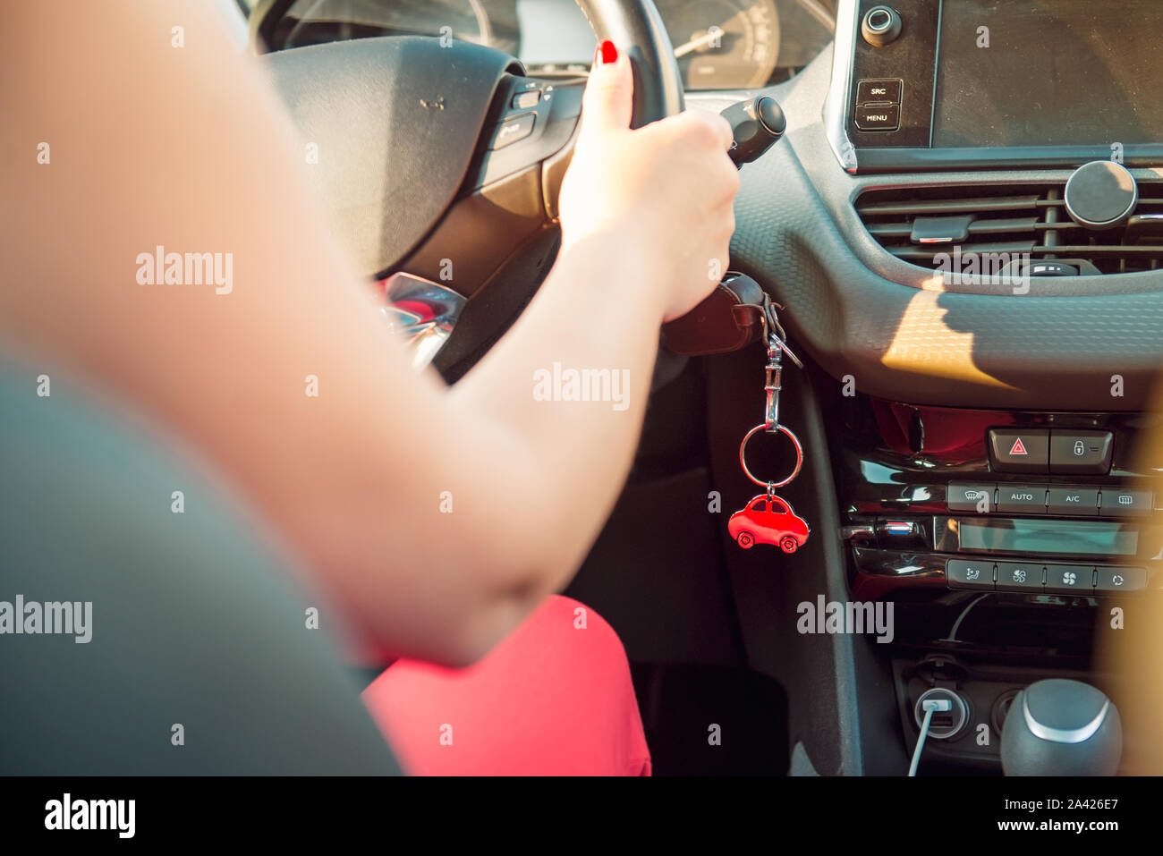 Car key in ignition. Start, stop or accelerate engine. Car shape keyfob ...