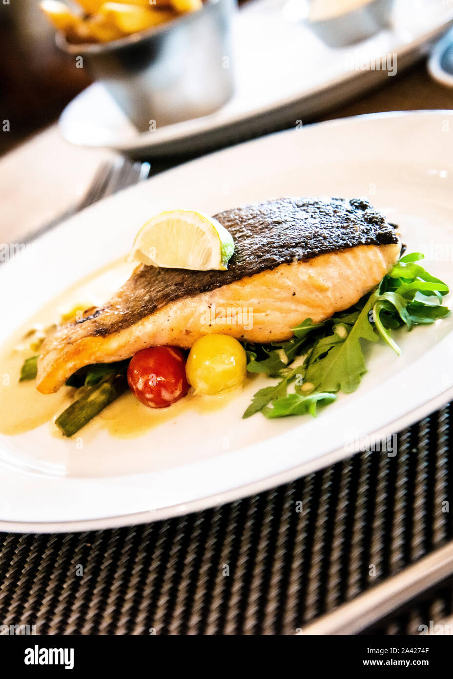 classic healthy food diet, grilled fresh salmon laid on a bed of ...