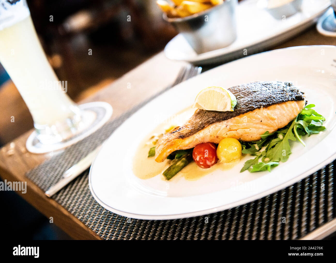 classic healthy food diet, grilled fresh salmon laid on a bed of ...