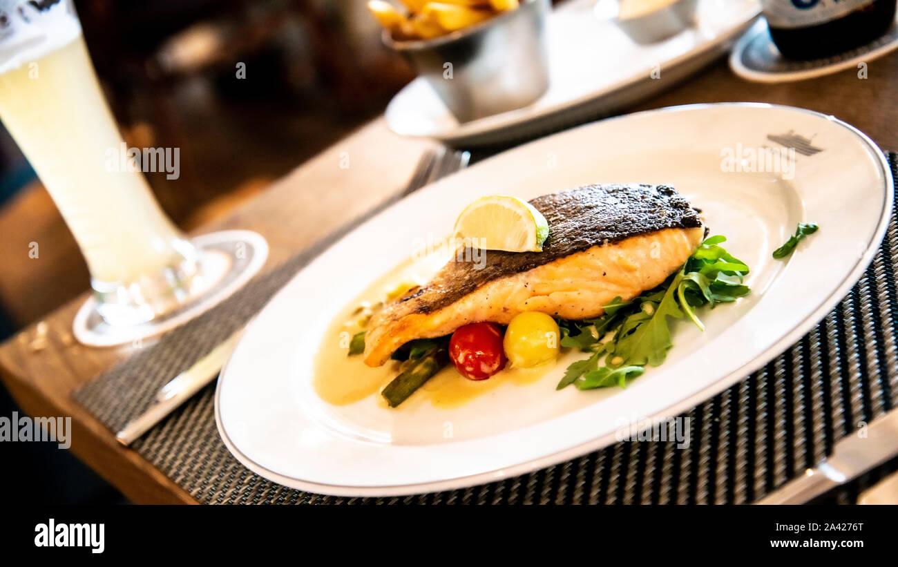 classic healthy food diet, grilled fresh salmon laid on a bed of ...