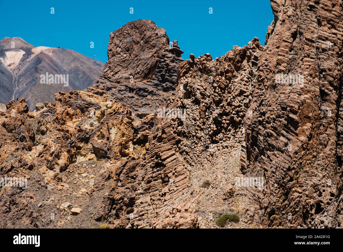 layered volcanic rock in desert landscape - stone formation Stock Photo ...