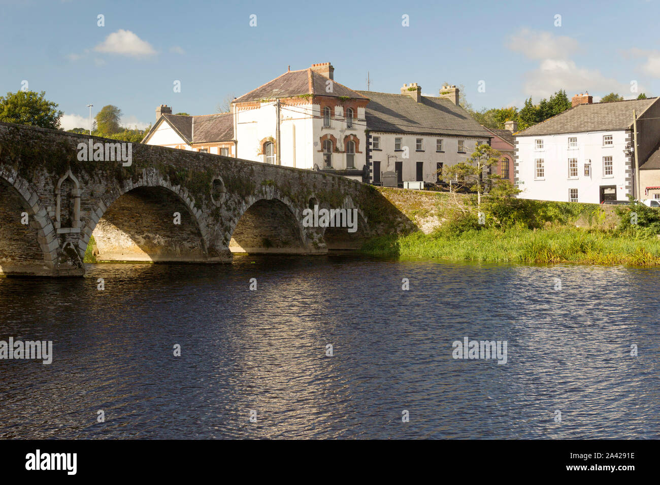 Image of the town of Graiguenamanagh with an old stone arched bridge ...