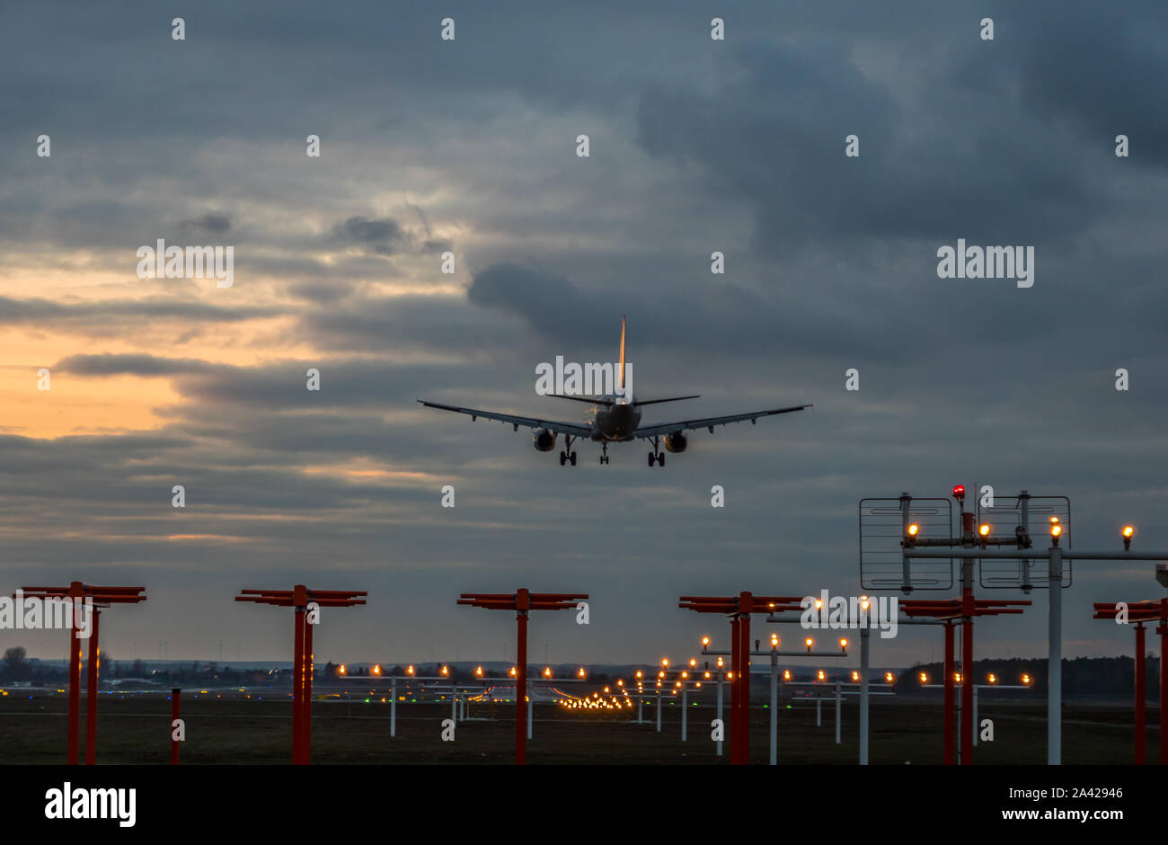 Passenger plane in landing approach Stock Photo - Alamy
