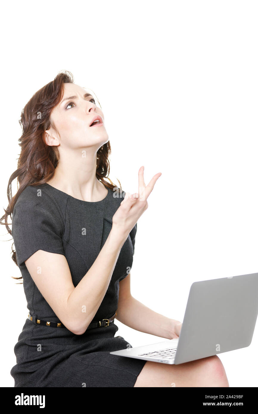 Business woman using laptop expressing concern and worry isolated on ...