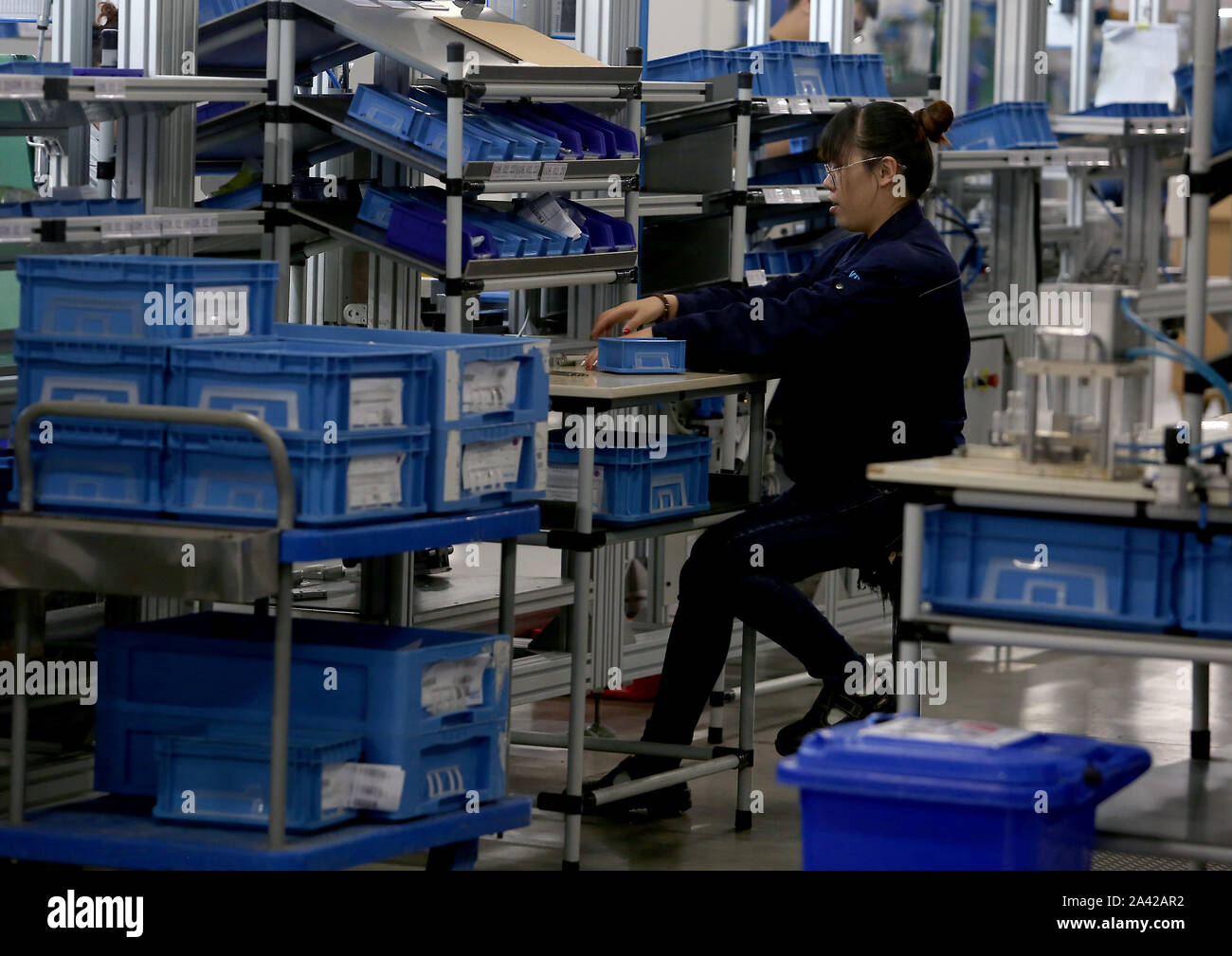 Jinan, China. 11th Oct, 2019. Chinese employees work at Festo's ...