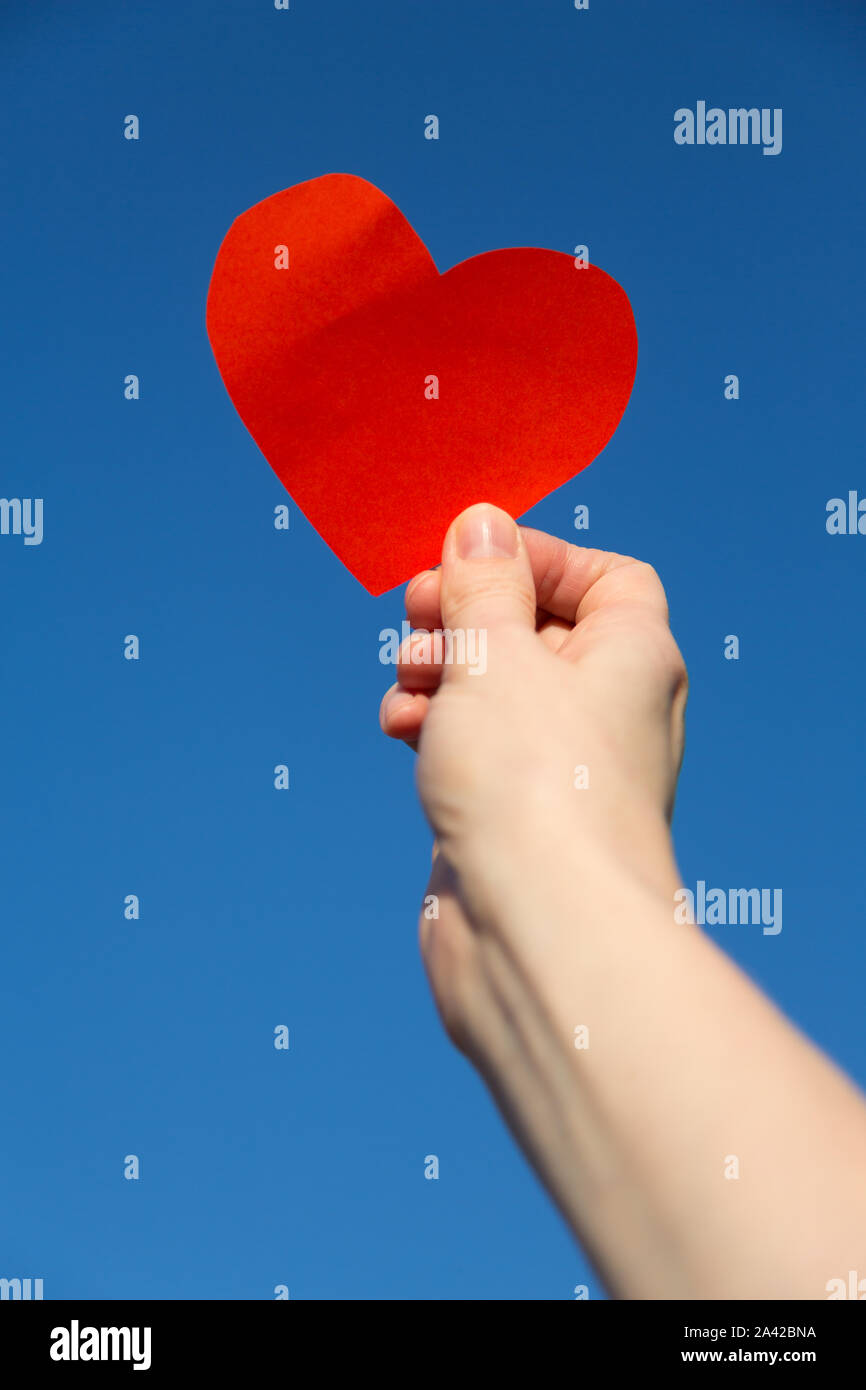 Hand holding a heart Stock Photo - Alamy