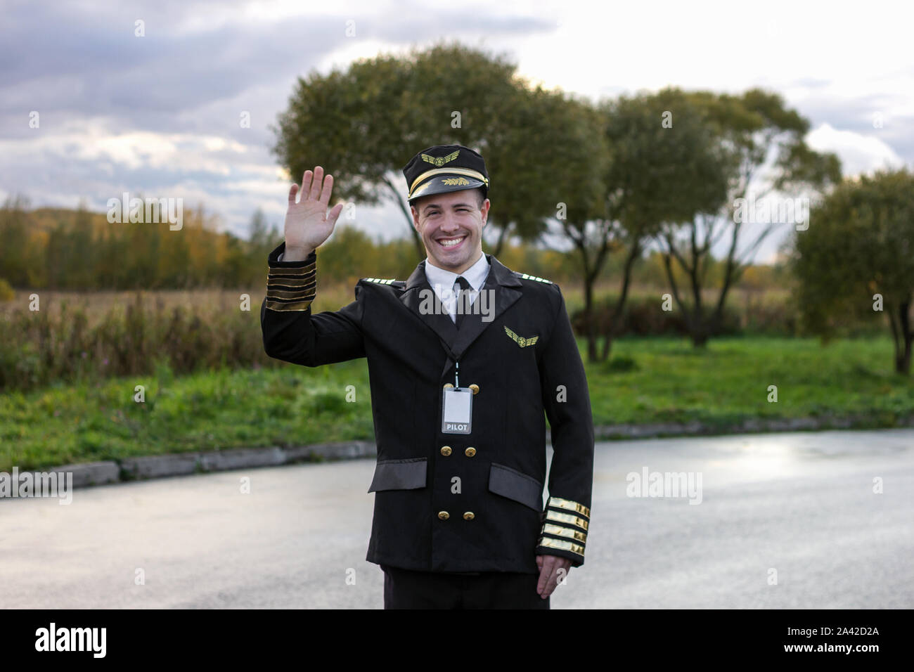 pilot welcomes waving commander airline aviator Stock Photo - Alamy