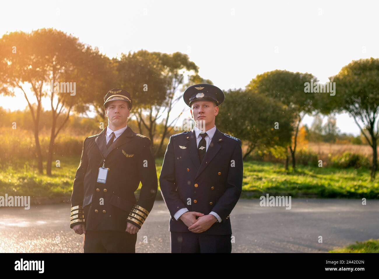 two pilots rain runway plane landing wet weather Stock Photo - Alamy