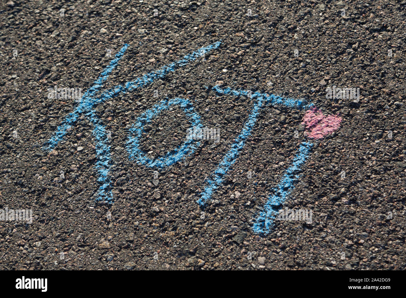 Chalk drawing or text in a asphalt Stock Photo - Alamy