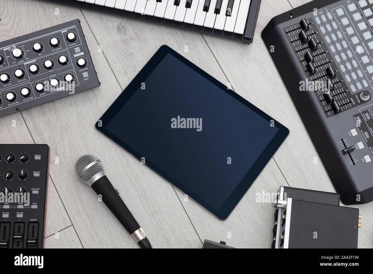 Empty tablet and electronic music instruments Stock Photo - Alamy
