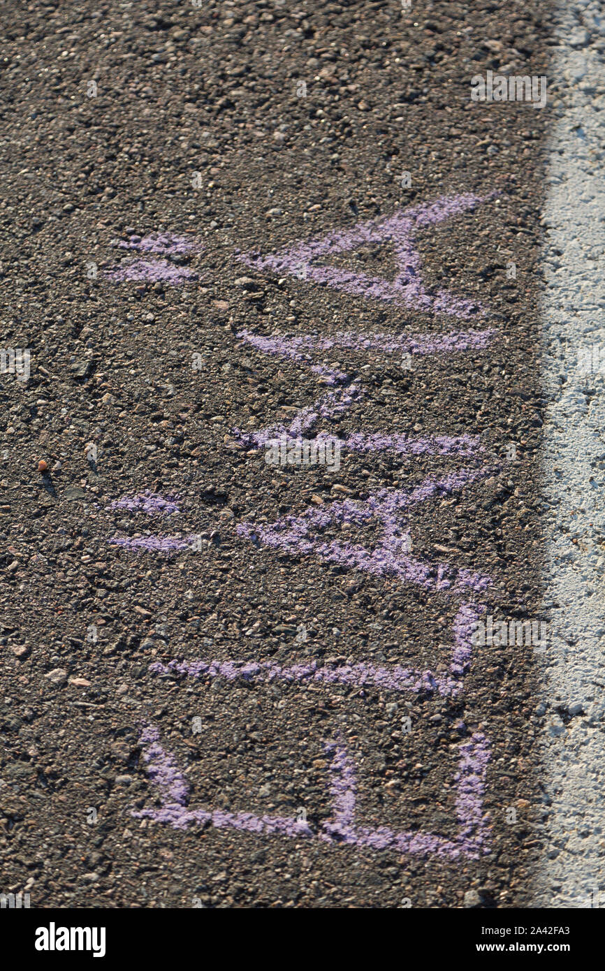 Chalk drawing or text in a asphalt Stock Photo - Alamy
