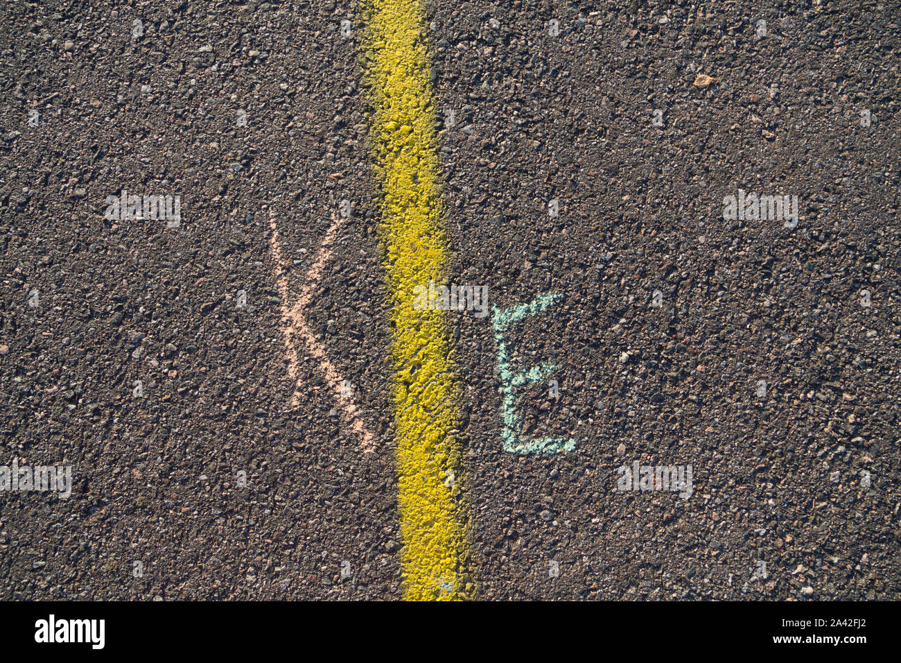 Chalk drawing or text in a asphalt Stock Photo - Alamy
