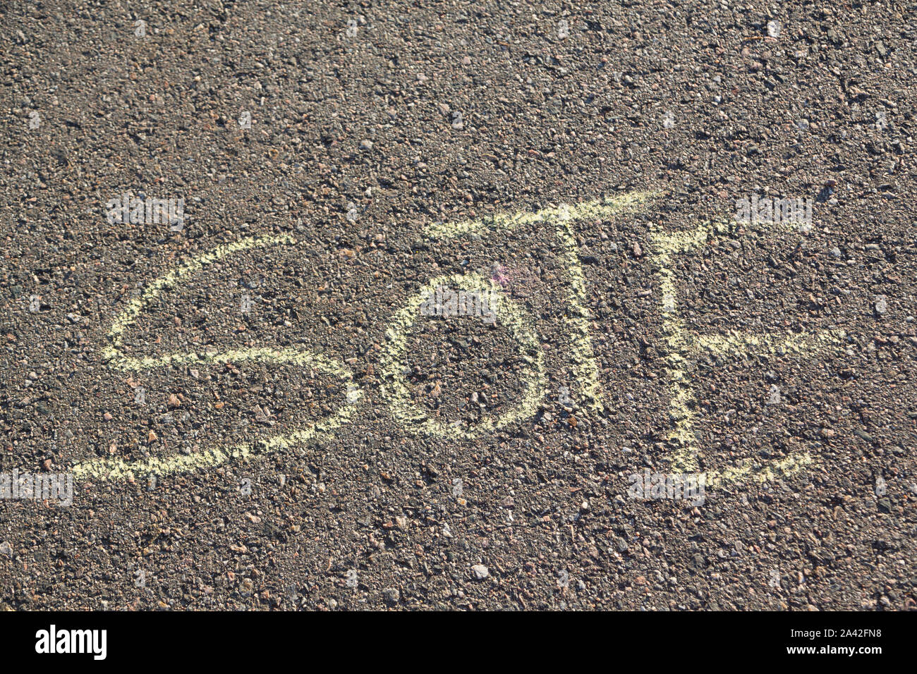 Chalk drawing or text in a asphalt Stock Photo - Alamy