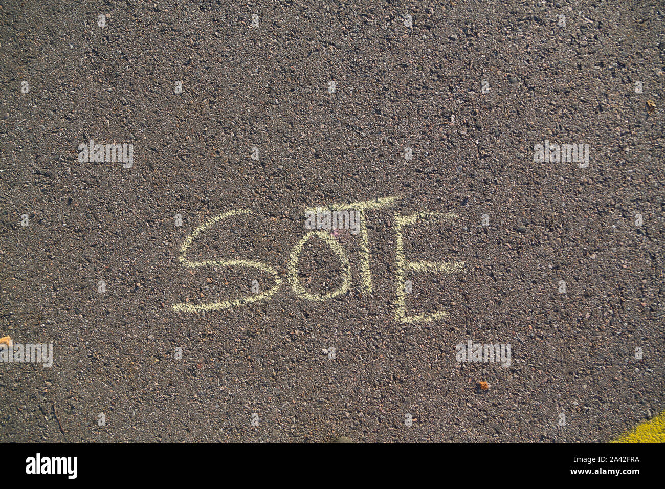 Chalk drawing or text in a asphalt Stock Photo - Alamy