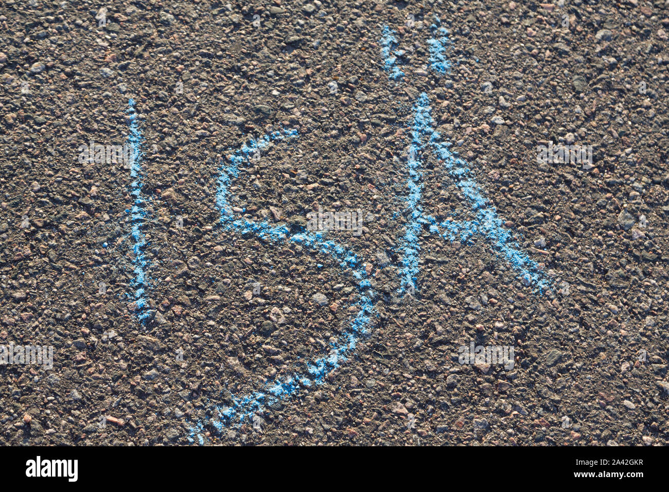 Chalk drawing or text in a asphalt Stock Photo - Alamy